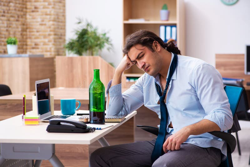 Young Male Employee Drinking Alcohol at Workplace Stock Photo - Image ...