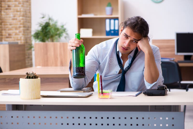 Young Male Employee Drinking Alcohol at Workplace Stock Image - Image ...