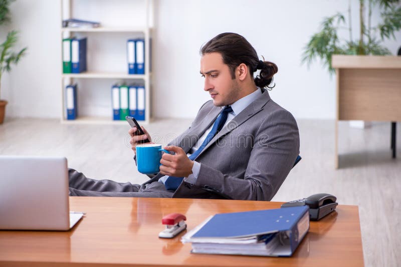 Young Male Employee Drinking Coffee in the Office Stock Image - Image ...