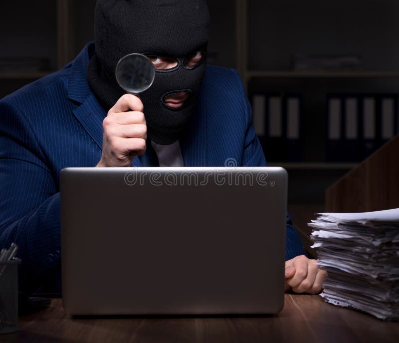 Male Employee Stealing Information in the Office Night Time Stock Photo ...