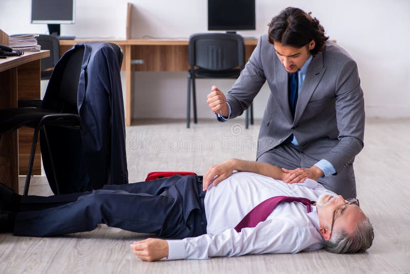 Male Employee Suffering from Heart Attack in the Office Stock Photo ...
