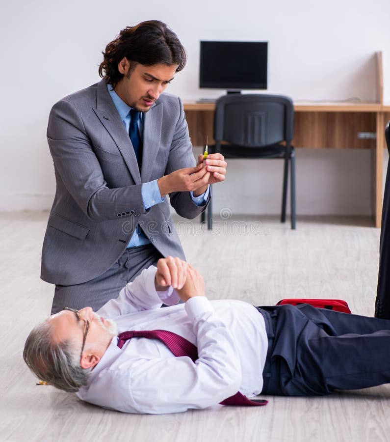 Male Employee Suffering from Heart Attack in the Office Stock Photo ...