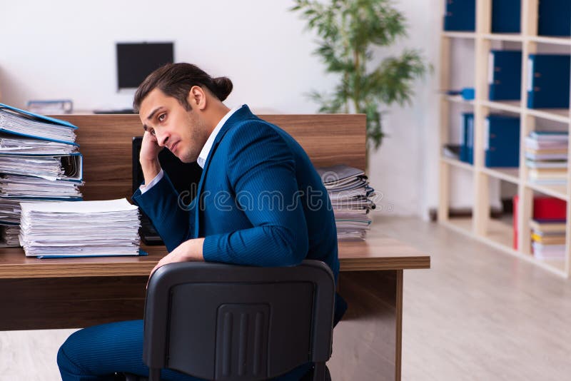 Young Male Employee Unhappy with Excessive Work in the Office Stock ...