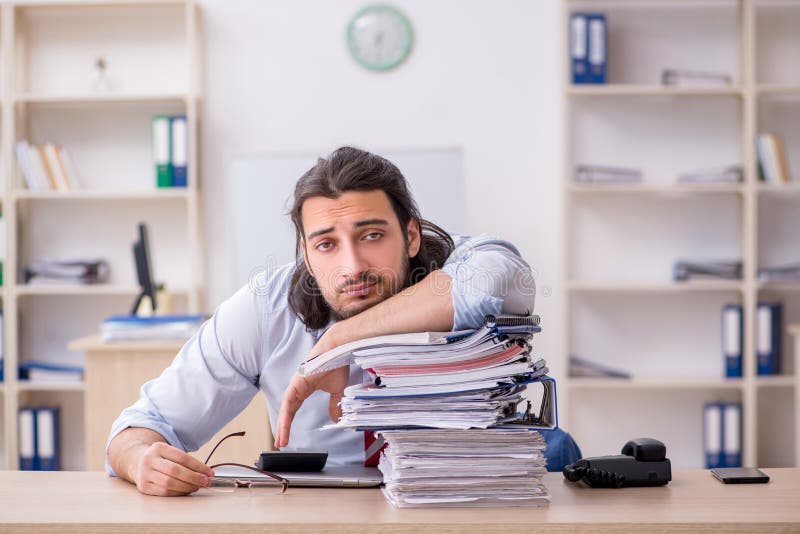 Young Male Employee Unhappy with Excessive Work Stock Photo - Image of ...