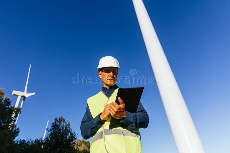 Male Energy Engineer Works with Wind Turbines. Stock Photo - Image of ...
