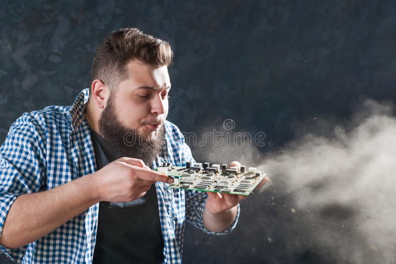 Male Engineer Blows Off Dust Motherboard Stock Photos - Free & Royalty ...