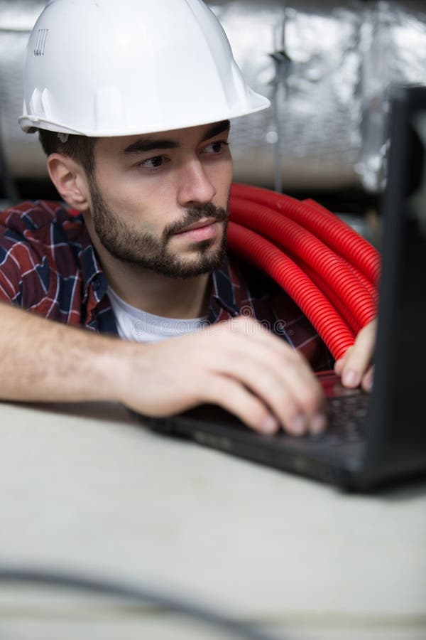 Male Engineer Checking Plan on Laptop Stock Image - Image of indoors ...