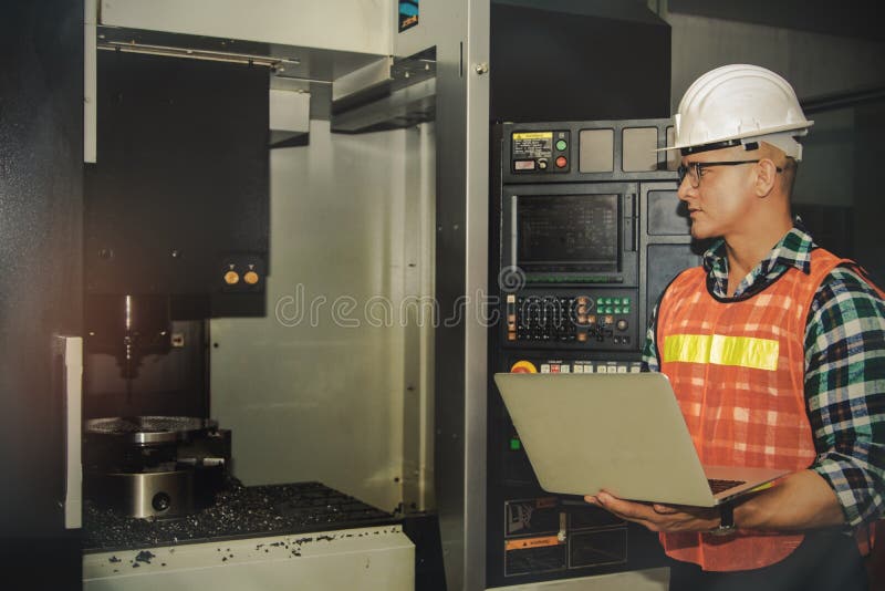 The Male Engineer Determines the Operation of the Lathe Automatically ...