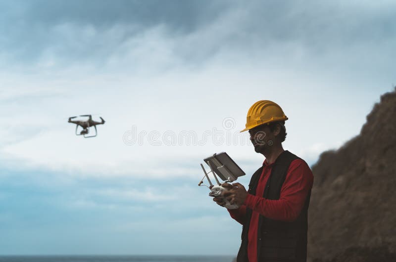 Male Engineer Doing Inspection Using Drone - Technology and Industrial ...