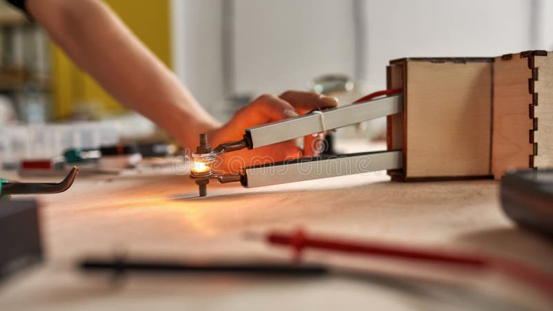 Male Engineer Doing Scientific Experiment at Table Stock Image - Image ...