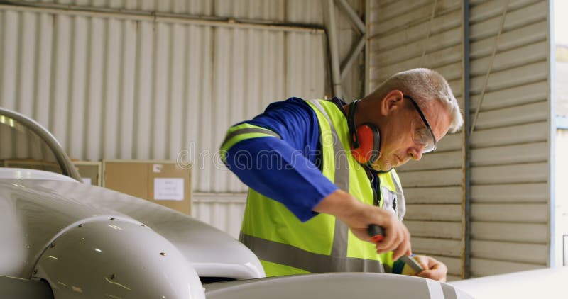 Engineer Finishing an Aircraft in Hangar 4k Stock Footage - Video of ...
