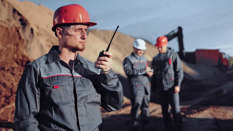 Male Engineer Giving Work Instruction Talking Using Walkie Talkie ...