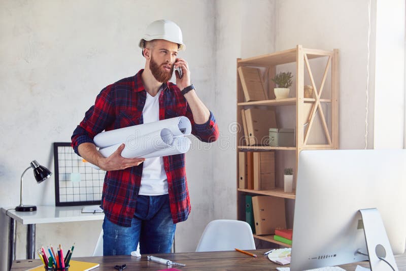 Male Engineer Holding Rolls of Designer Construction Plans Stock Image ...