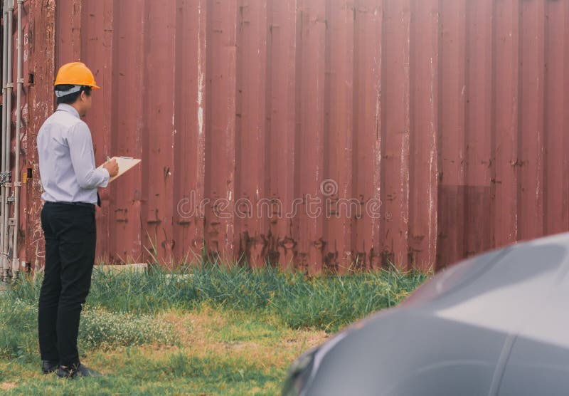 Male Engineer Inspection Checking on Container Background with Note on ...