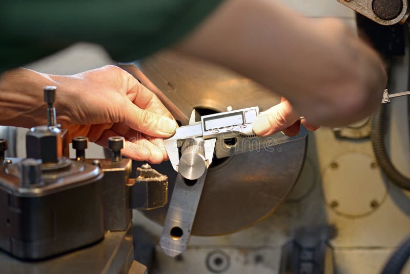 Male Engineer Measuring a Metallic Piece Stock Image - Image of ...