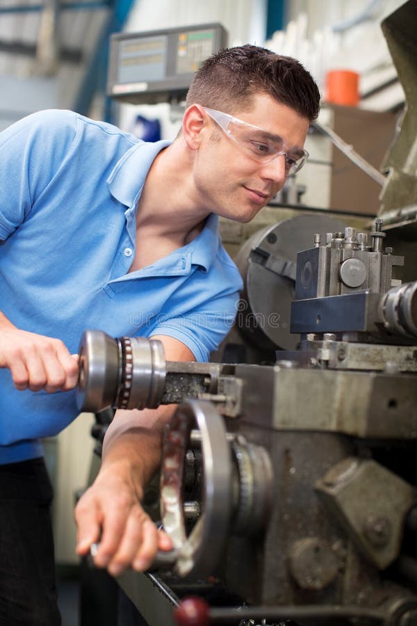Male Engineer Operating Lathe in Factory Stock Photo - Image of eyewear ...