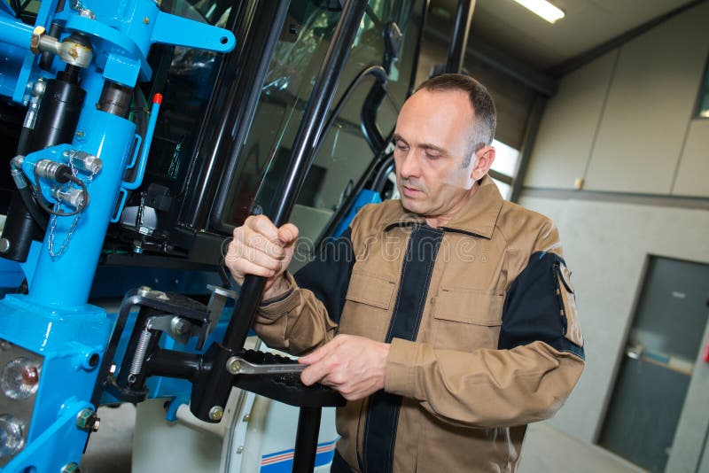 Male Engineer Operating Cnc Machinery in Factory Stock Photo - Image of ... Male Engineer Operating Cnc Machinery in Factory Stock Photo - Image of ...
