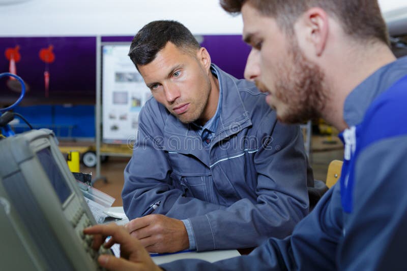 Male Students Looking at Graph on Flip Chart Stock Image - Image of ...