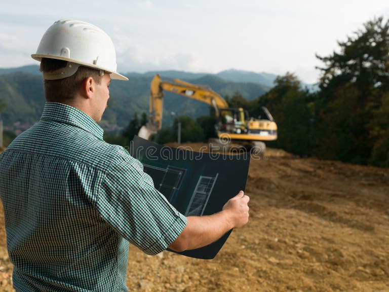 Male Engineer Reading Blueprint Stock Image - Image of document, back ...