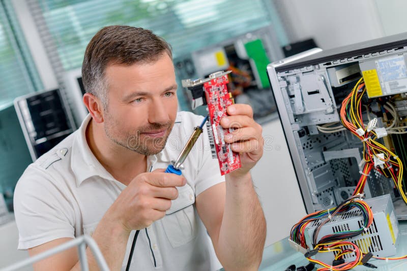 Male engineer repairing pc stock photo. Image of copper - 286471970