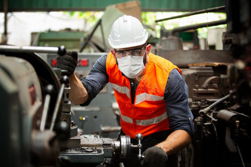 Male Engineer Staff Operating a Cnc Machine in Factory Stock Photo ... Male Engineer Staff Operating a Cnc Machine in Factory Stock Photo ...