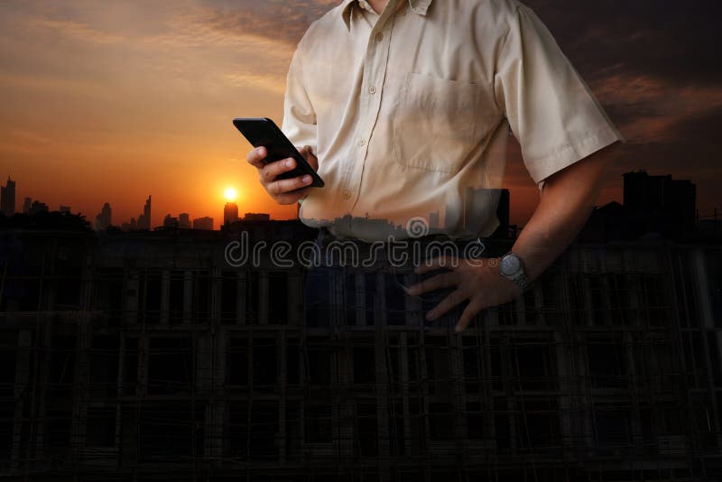 Male Engineer Standing with Smartphone with Concept and Engineer Stock ...