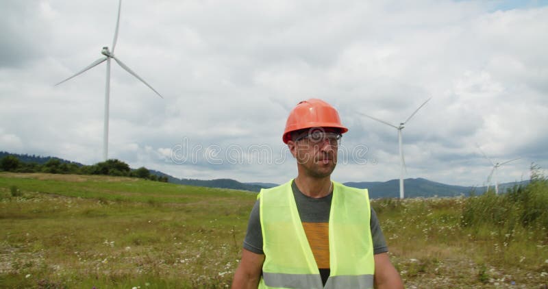 Male Engineer Standing in a Windmill Alone. he Felt Refreshed among the ...