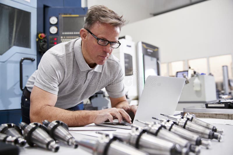 Male Engineer Using CAD Programming Software on Laptop Stock Image ...