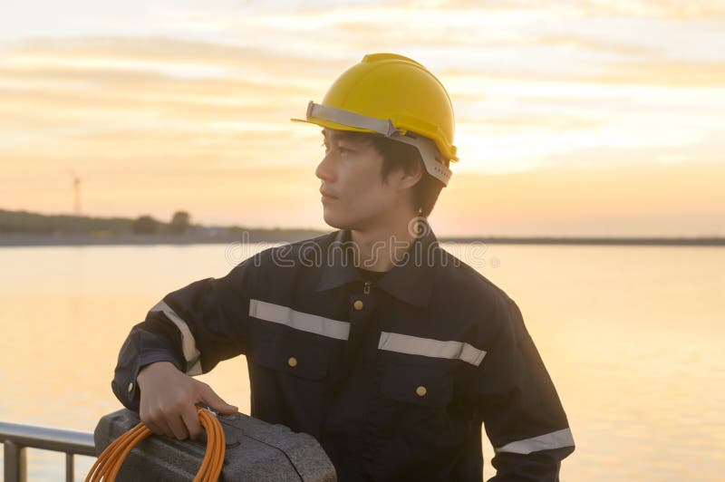 Male Engineer Wearing a Protective Helmet at Sunset Stock Photo - Image ...