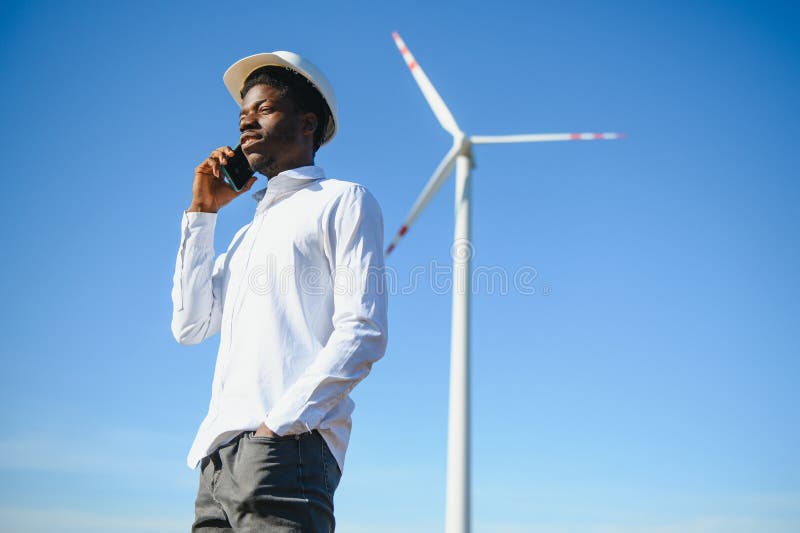 Male Engineer on Windmill Farm for Electric Power Production Stock ...