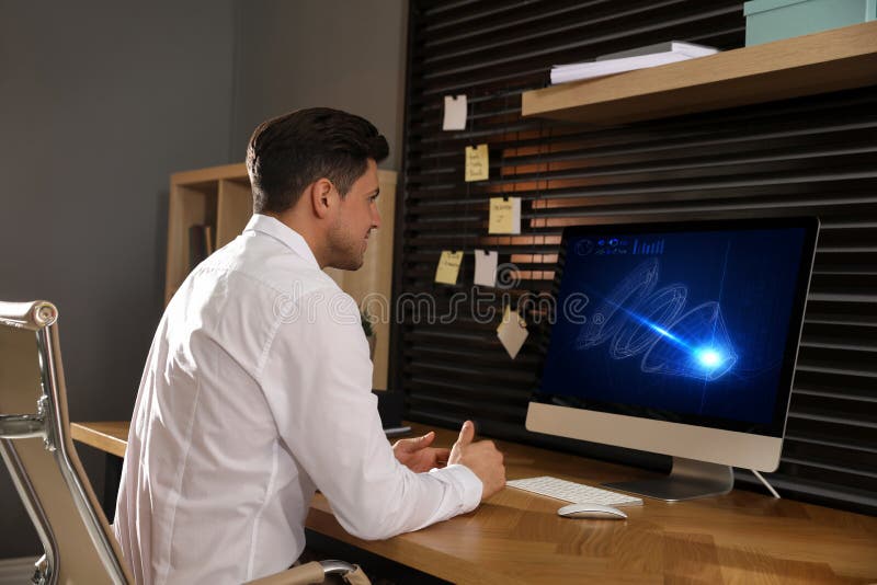 Male Engineer Working with Technical Drawing on Computer, Top View ...