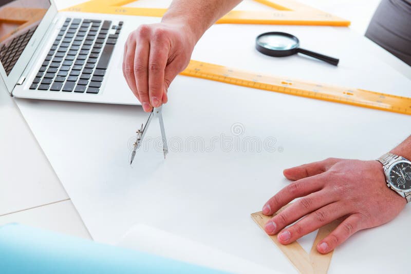 The Male Engineer Working on Drawings and Blueprints Stock Photo ...