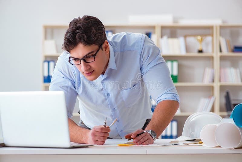 Male Engineer Working on Drawings and Blueprints Stock Photo - Image of ...