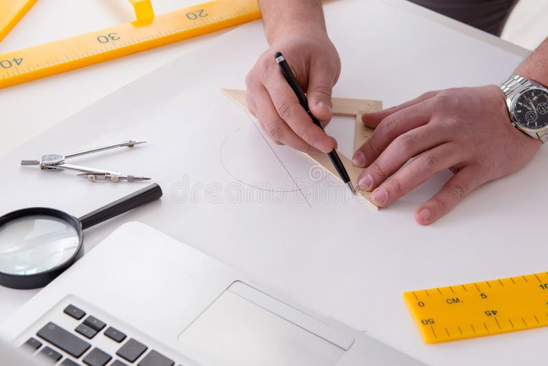 The Male Engineer Working on Drawings and Blueprints Stock Photo ...