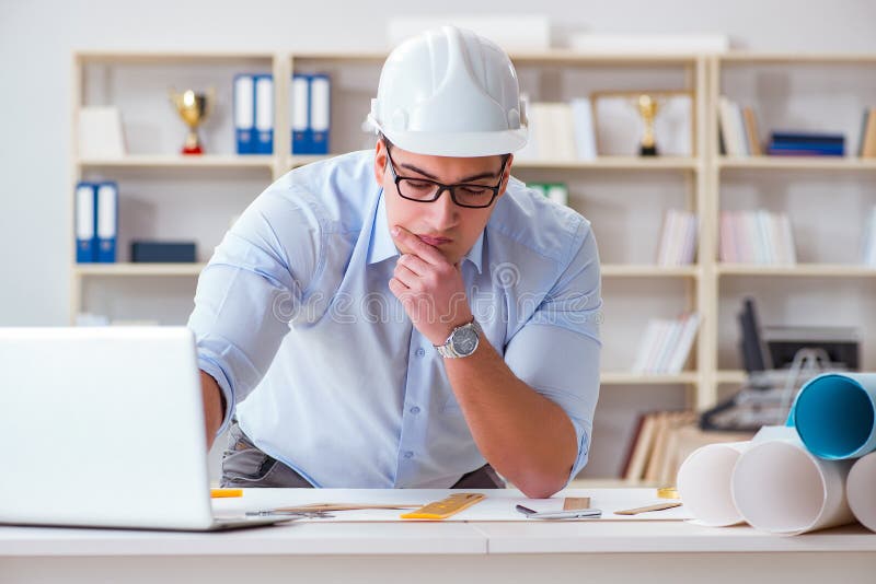 Male Engineer Working on Drawings and Blueprints Stock Photo - Image of ...