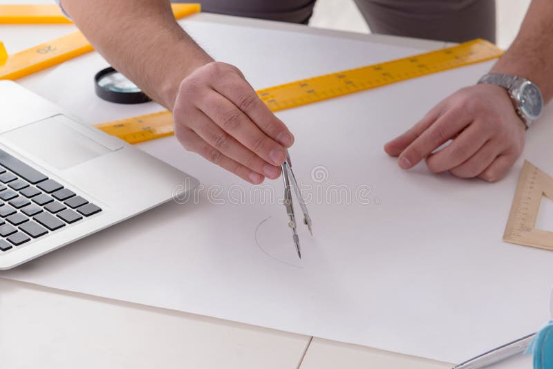 The Male Engineer Working on Drawings and Blueprints Stock Image ...