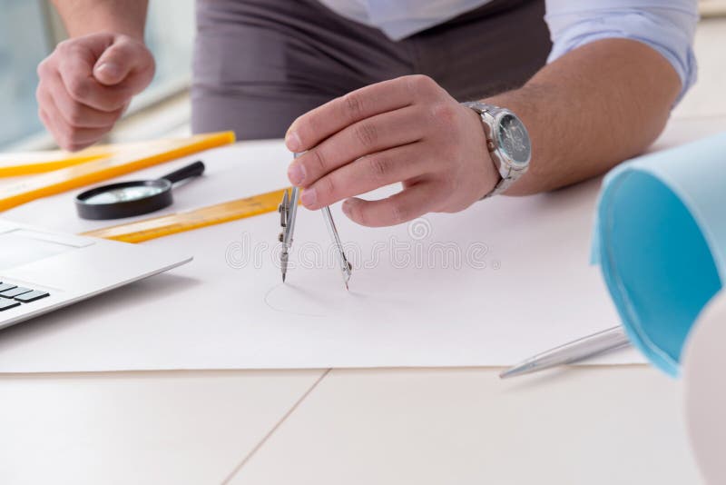 The Male Engineer Working on Drawings and Blueprints Stock Image ...