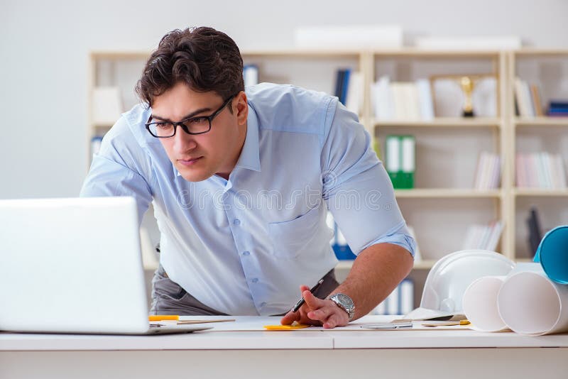 Male Engineer Working on Drawings and Blueprints Stock Photo - Image of ...