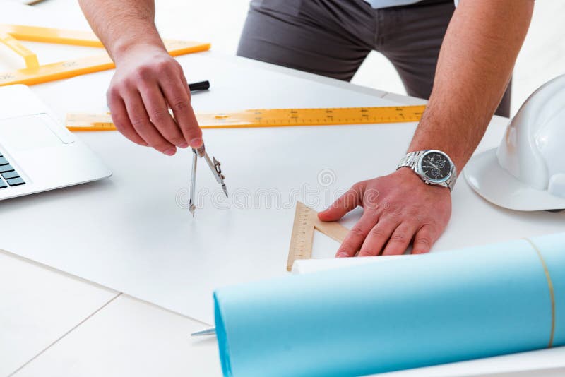 The Male Engineer Working on Drawings and Blueprints Stock Image ...