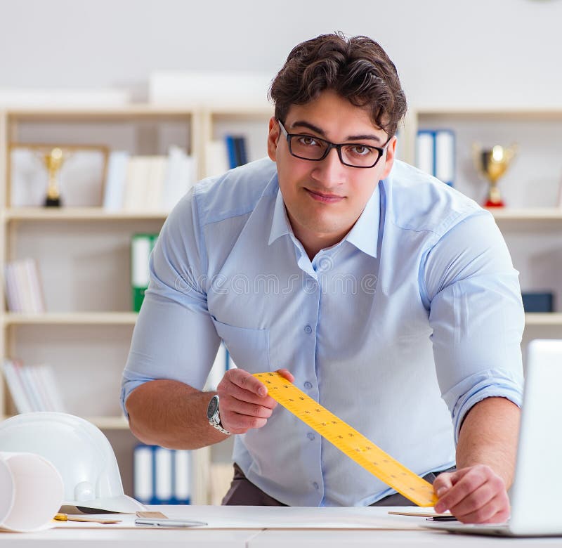 Male Engineer Working on Drawings and Blueprints Stock Image - Image of ...
