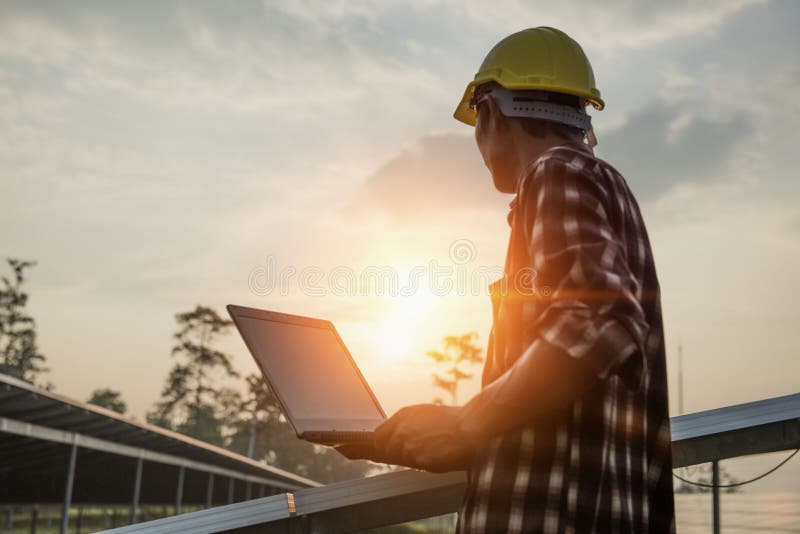 Male Engineer Working at High Level To Check Efficiency of Solar Cell ...