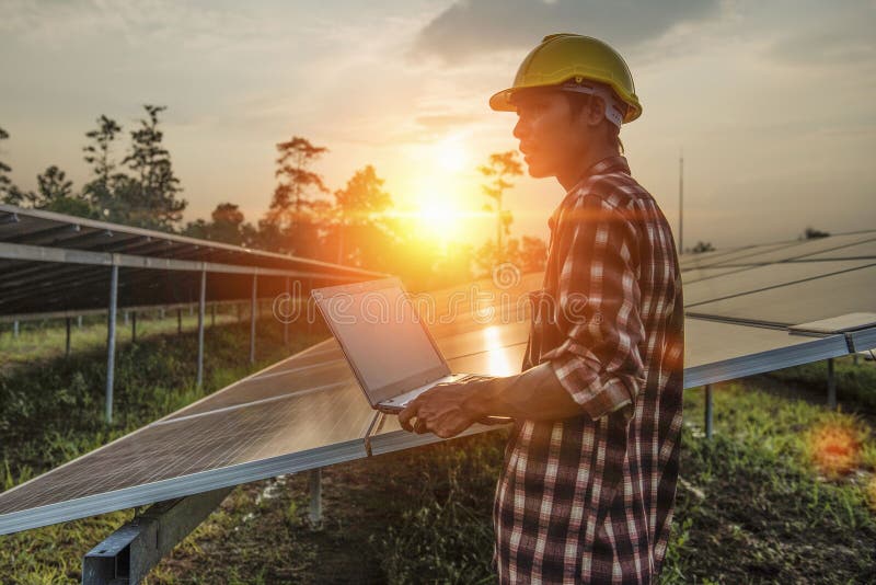 Male Engineer Working at High Level To Check Efficiency of Solar Cell ...