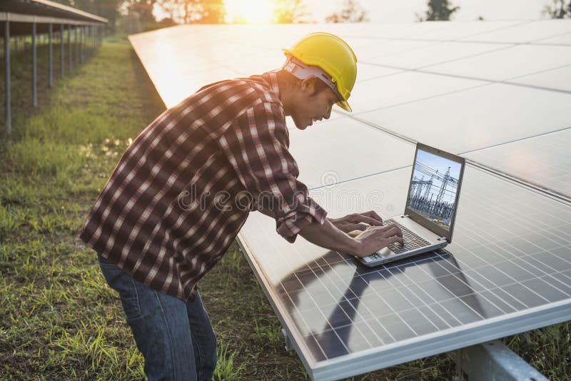 Male Engineer Working at High Level To Check Efficiency of Solar Cell ...