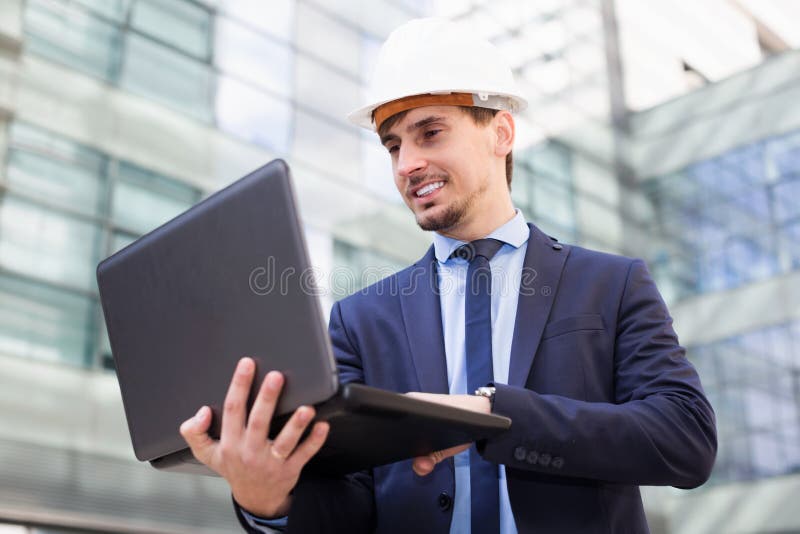 Male Engineer Working at the Laptop Outdoors Stock Photo - Image of ...