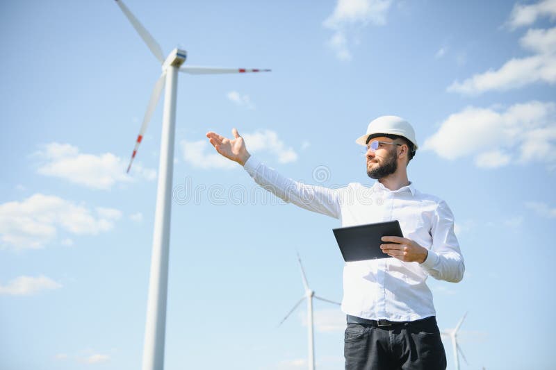 Male Engineer Working with Plan Inspecting or Maintenance of Wind ...
