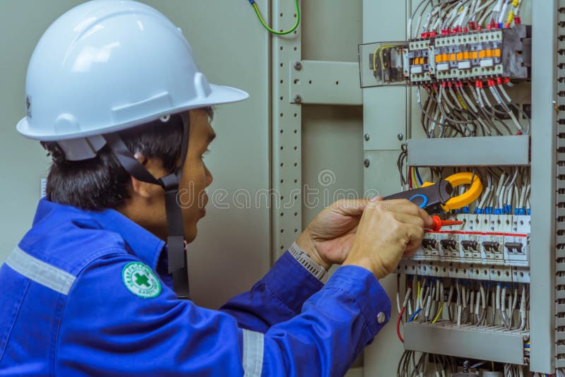 Male Engineers are Checking the Electrical System with Electronic Tools ...