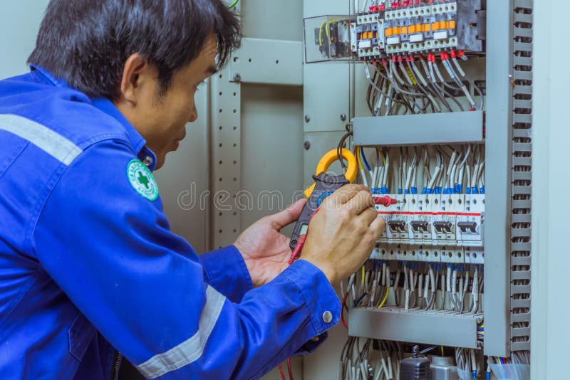 Male Engineers are Checking the Electrical System with Electronic Tools ...