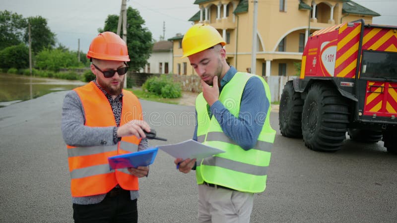 Male Engineers Solve Flood Problem. Devastation Wrought after Massive ...