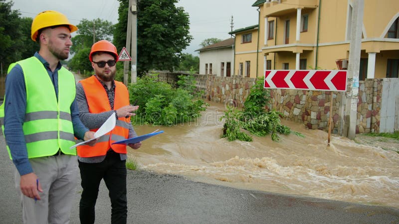 Male Engineers Solve Flood Problem. Devastation Wrought after Massive ...