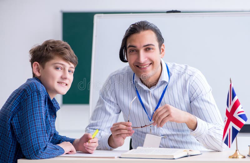 Male English Teacher and Boy in the Classroom Stock Photo - Image of ...